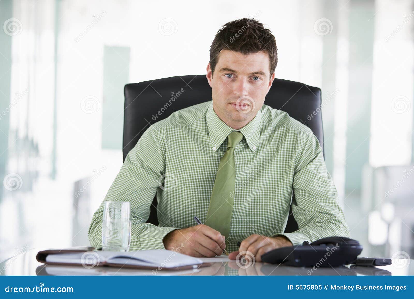 Businessman Sitting in Office Stock Image - Image of indoors ...