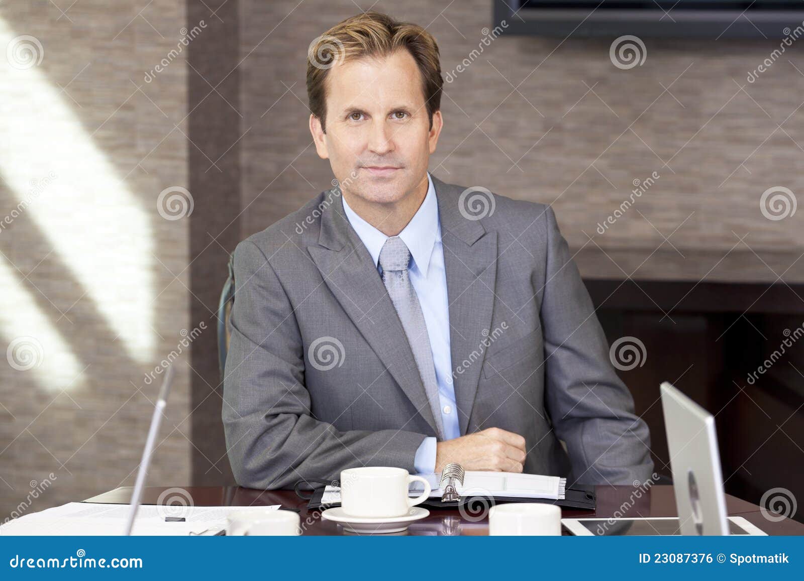 Businessman Sitting in Office Boardroom Stock Photo - Image of ...