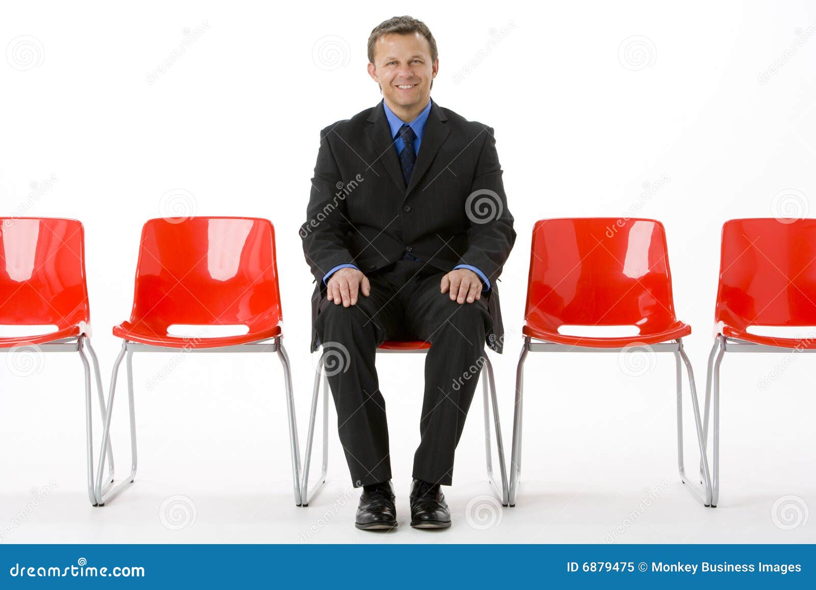 Businessman Sitting in Row of Empty Chairs Stock Image - Image of chair ...