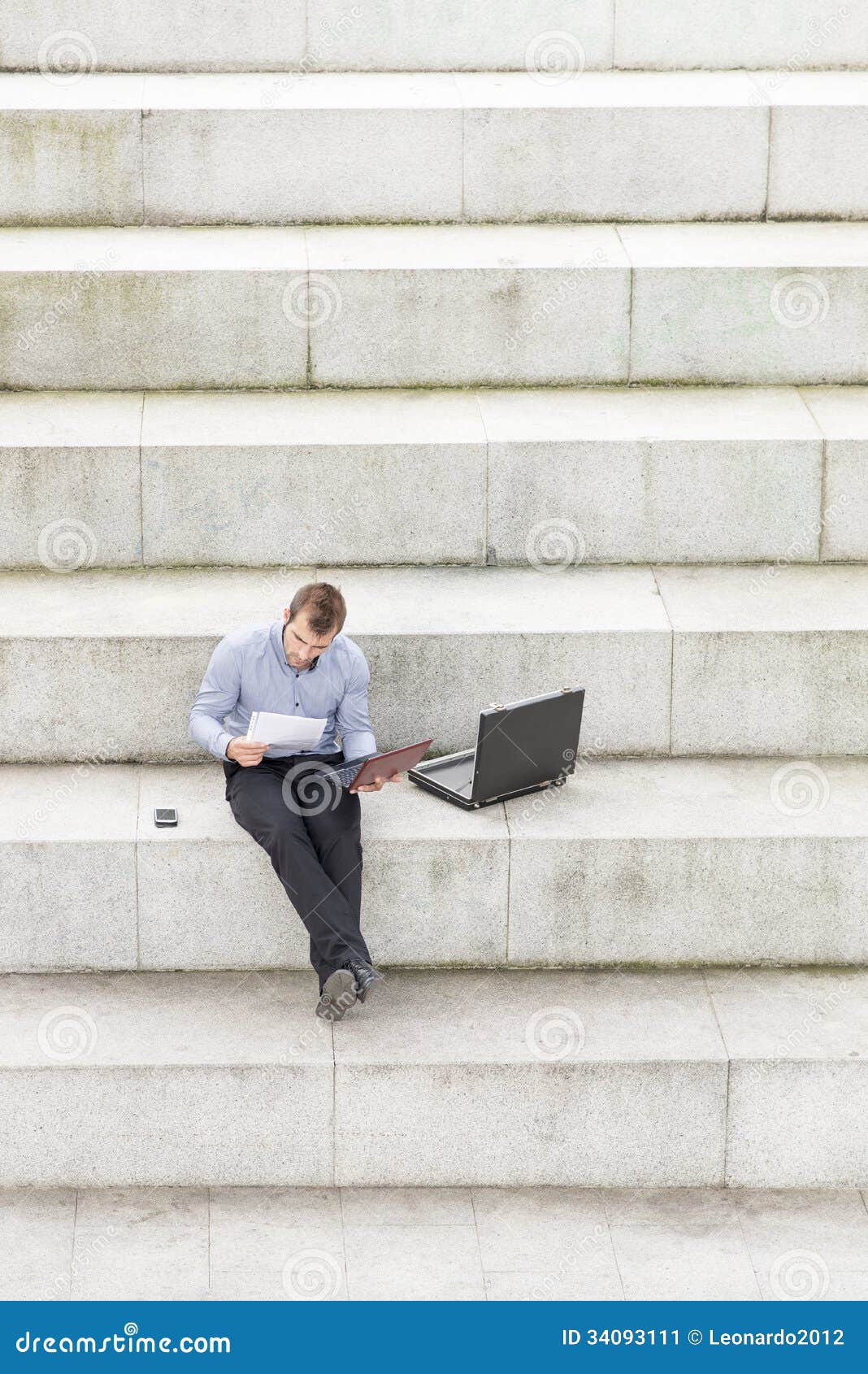 Businessman Sitting on the Steps and Laptop Computer. Stock Image ...