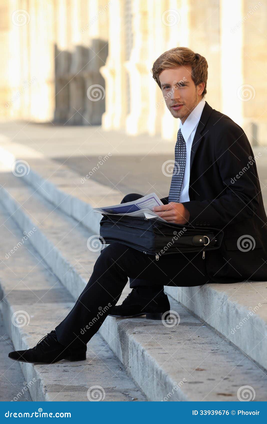 Businessman Sitting on Steps Stock Photo - Image of standing ...