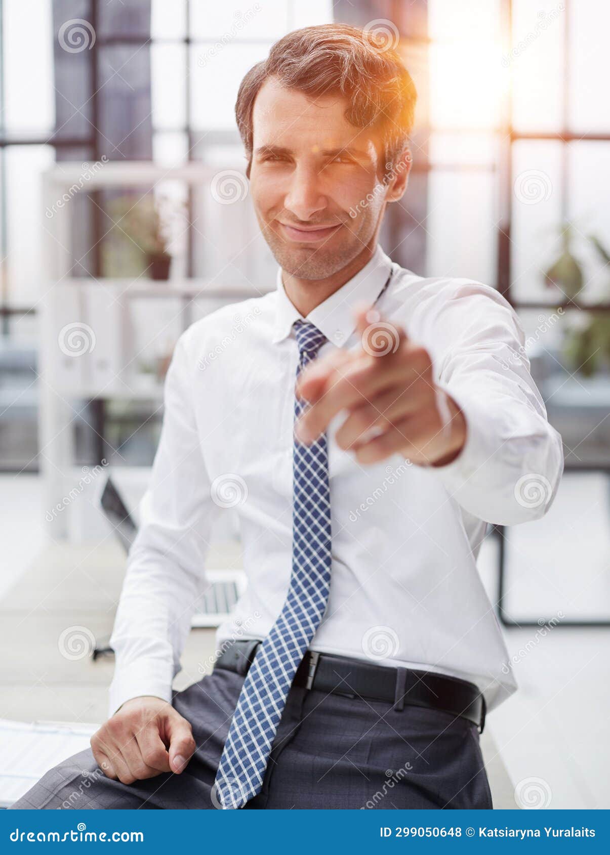 Businessman Sitting on the Table and Pointing at You Stock Photo ...