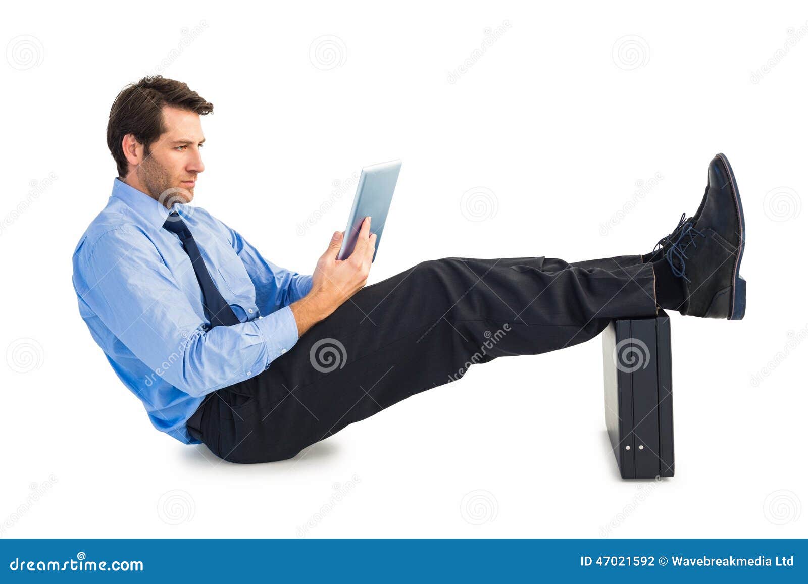 Businessman Sitting Using Tablet Stock Photo - Image of hair, feet ...