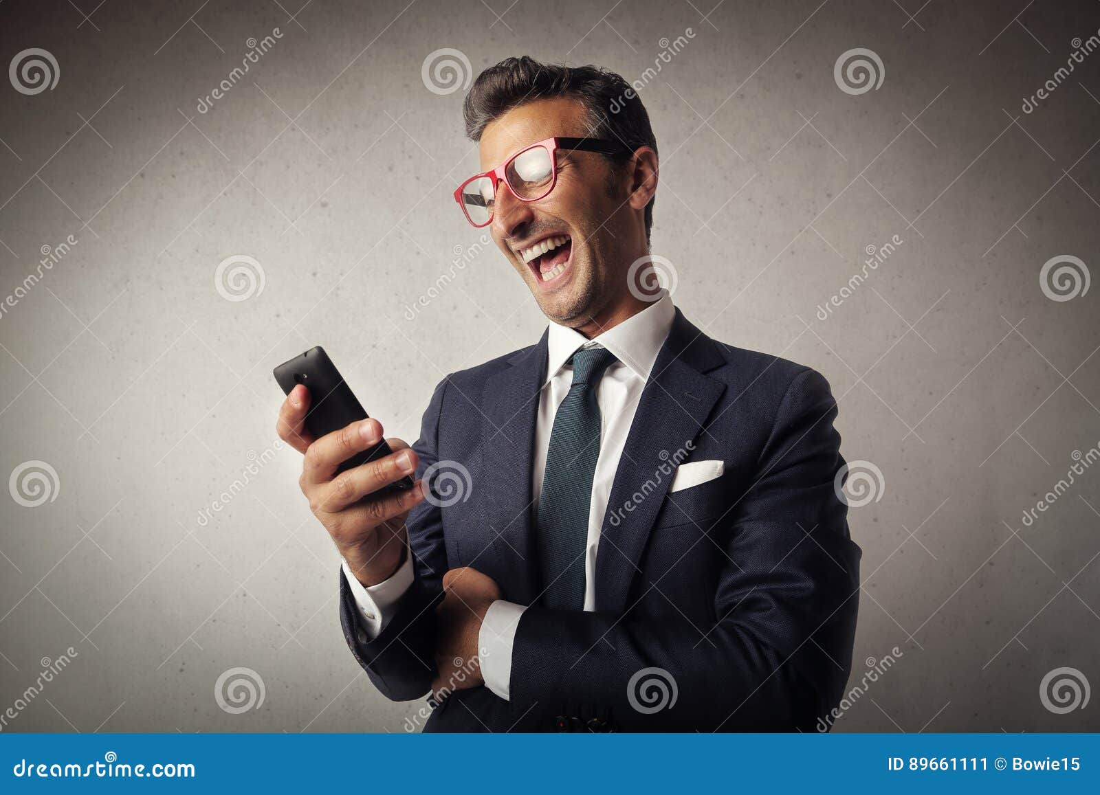 Businessman with a Smartphone Laughing Stock Image - Image of portrait ...