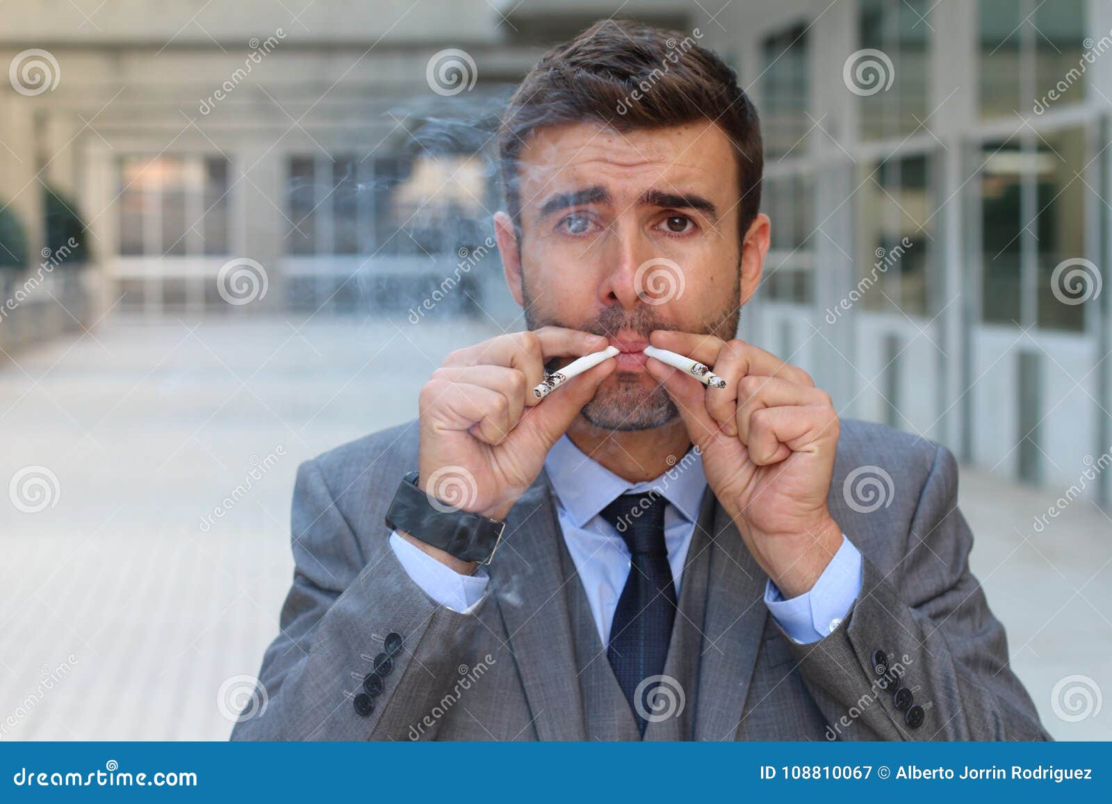 Businessman Smoking Four Cigarettes at the Same Time Stock Image ...