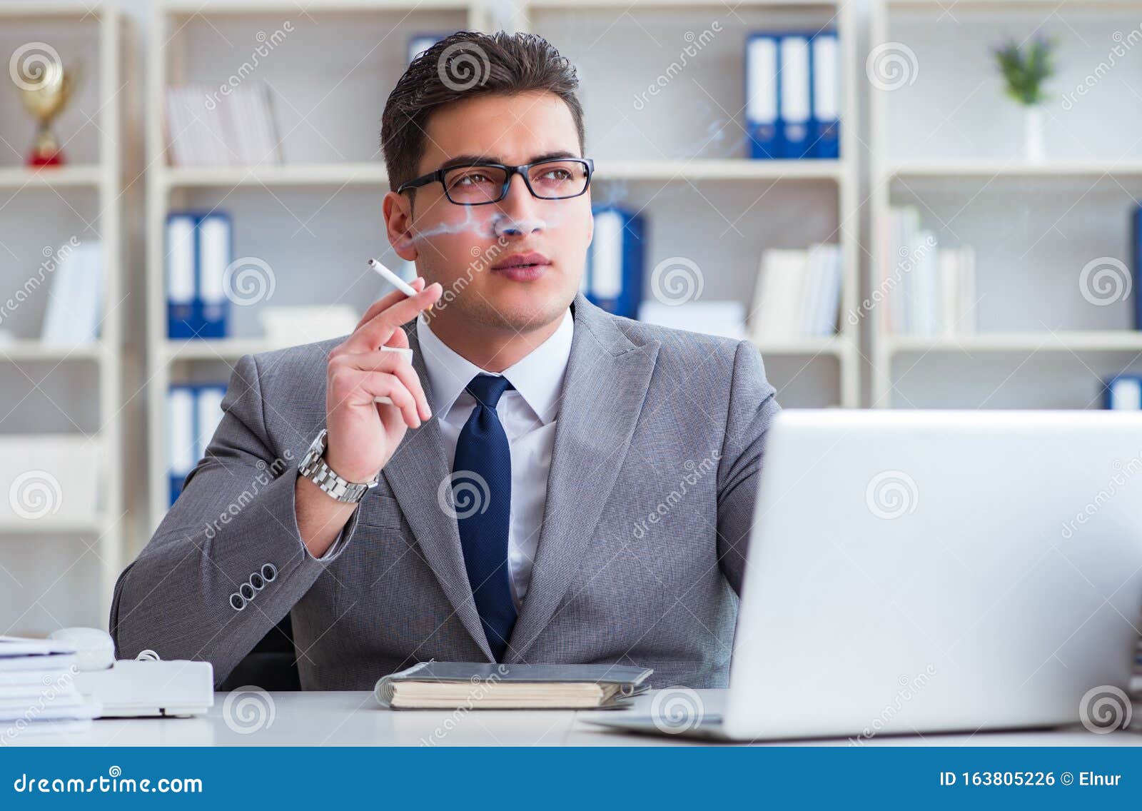Businessman Smoking in Office at Work Stock Photo - Image of ...