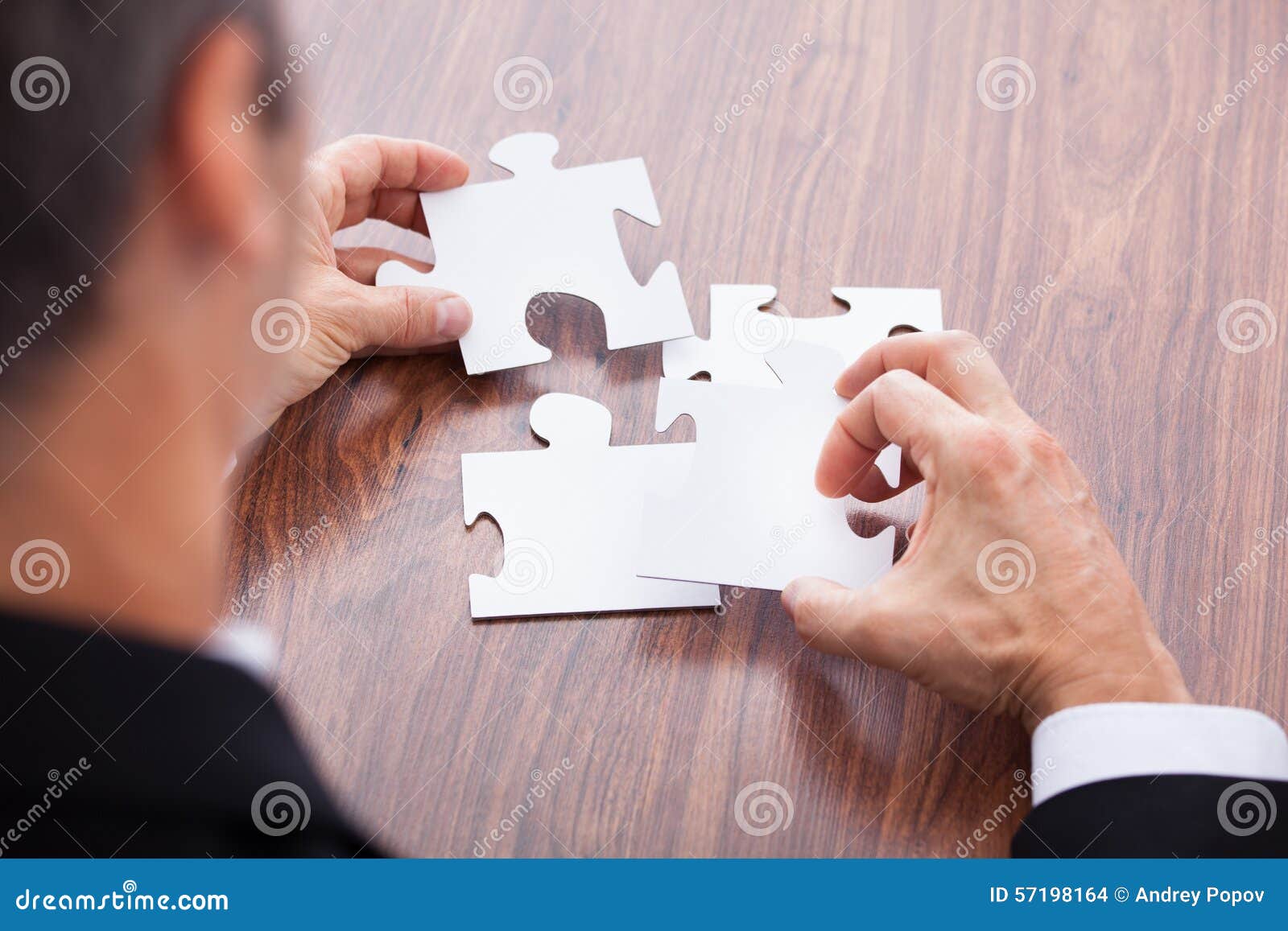 Businessman Solving Jigsaw Puzzle Stock Photo - Image of match ...