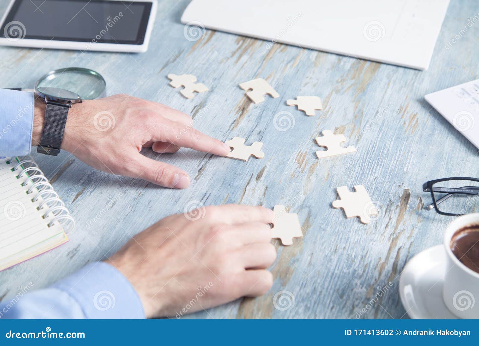 Businessman Solving Puzzle at the Office Desk Stock Photo - Image of ...