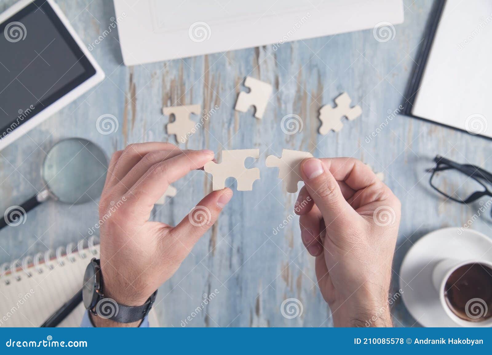 Businessman Solving Puzzle at the Office Desk Stock Photo - Image of ...