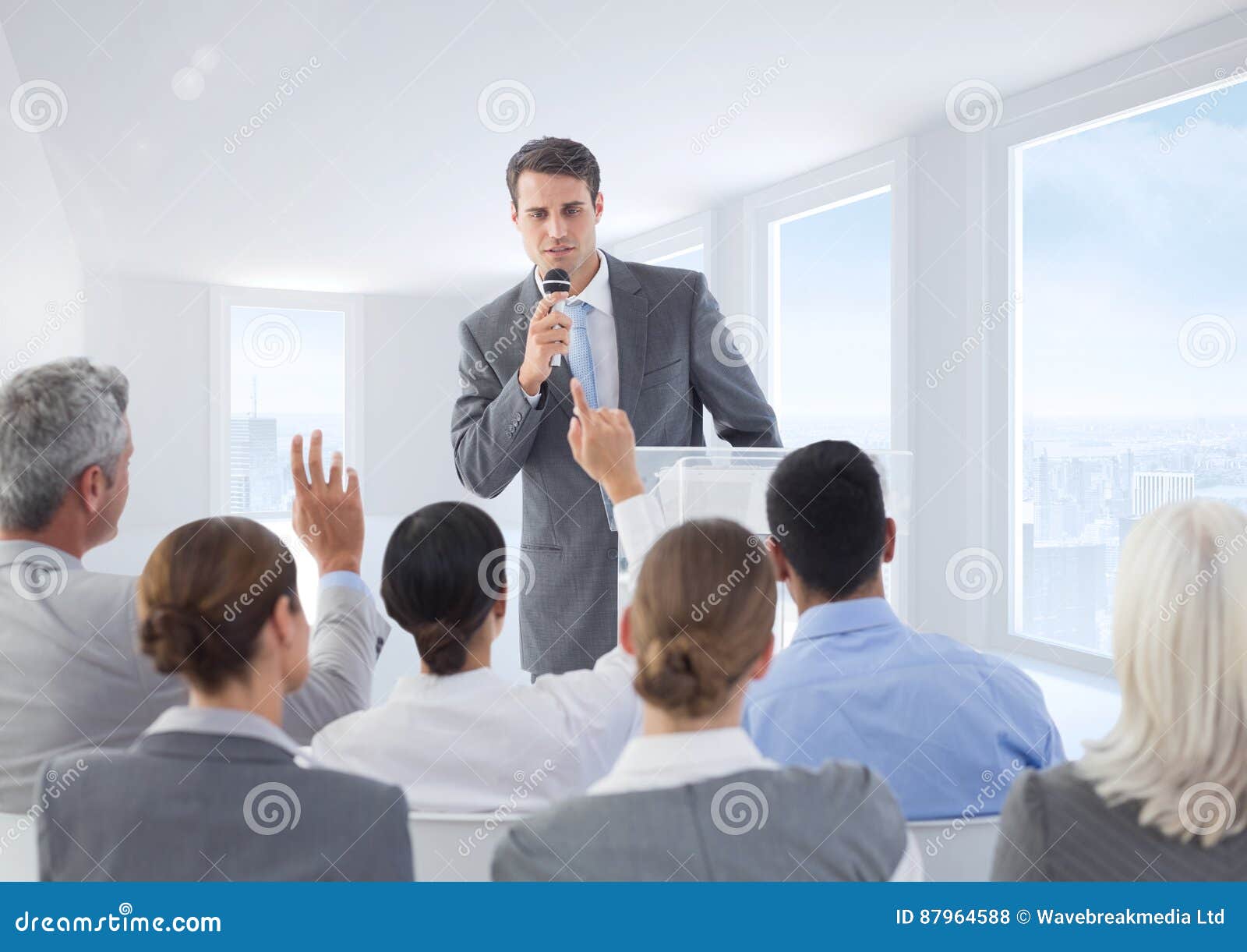 Businessman Speaking on Microphone in Meeting Stock Photo - Image of ...