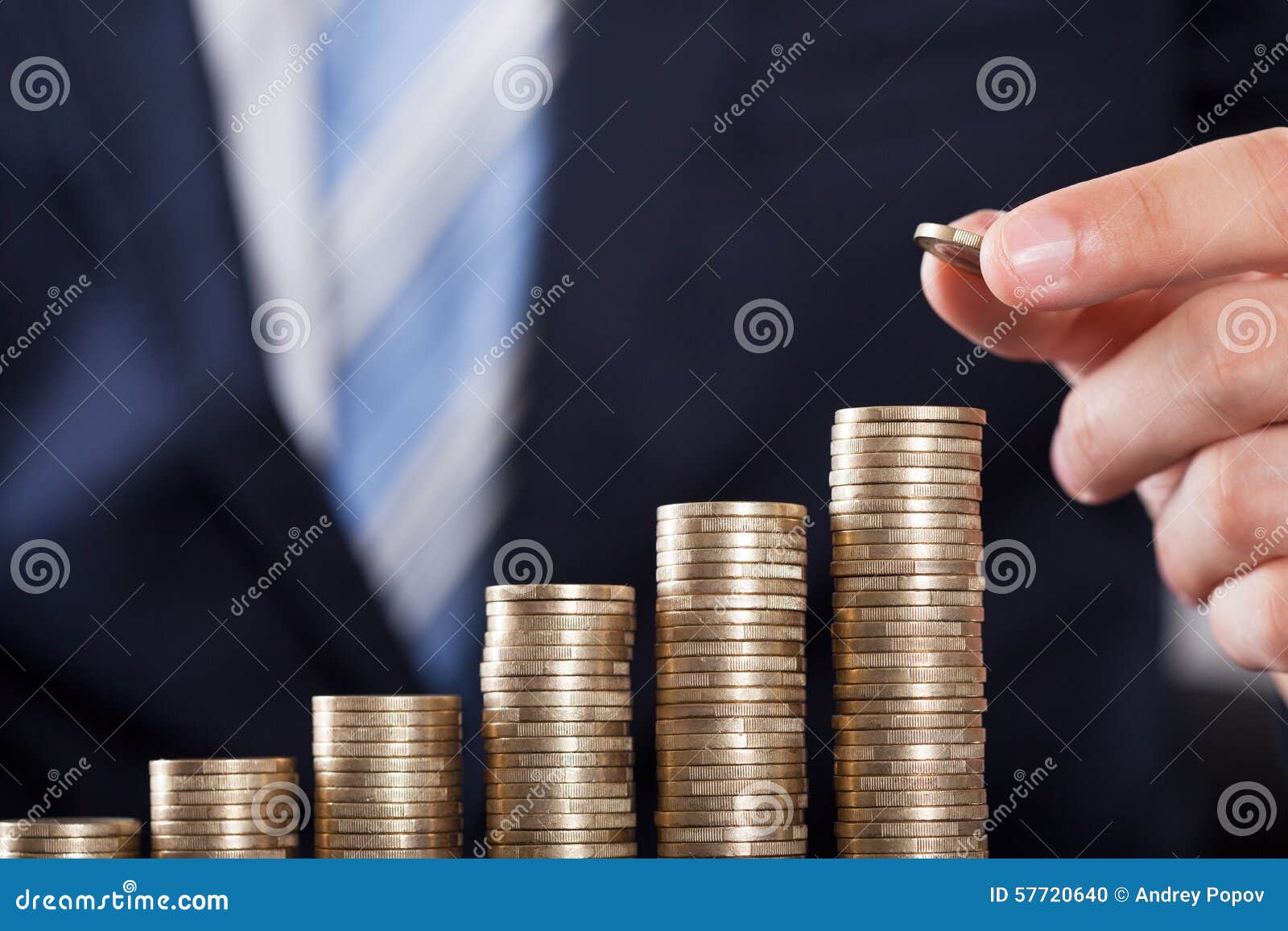 Businessman Stacking Coins at Desk Stock Photo - Image of adult ...