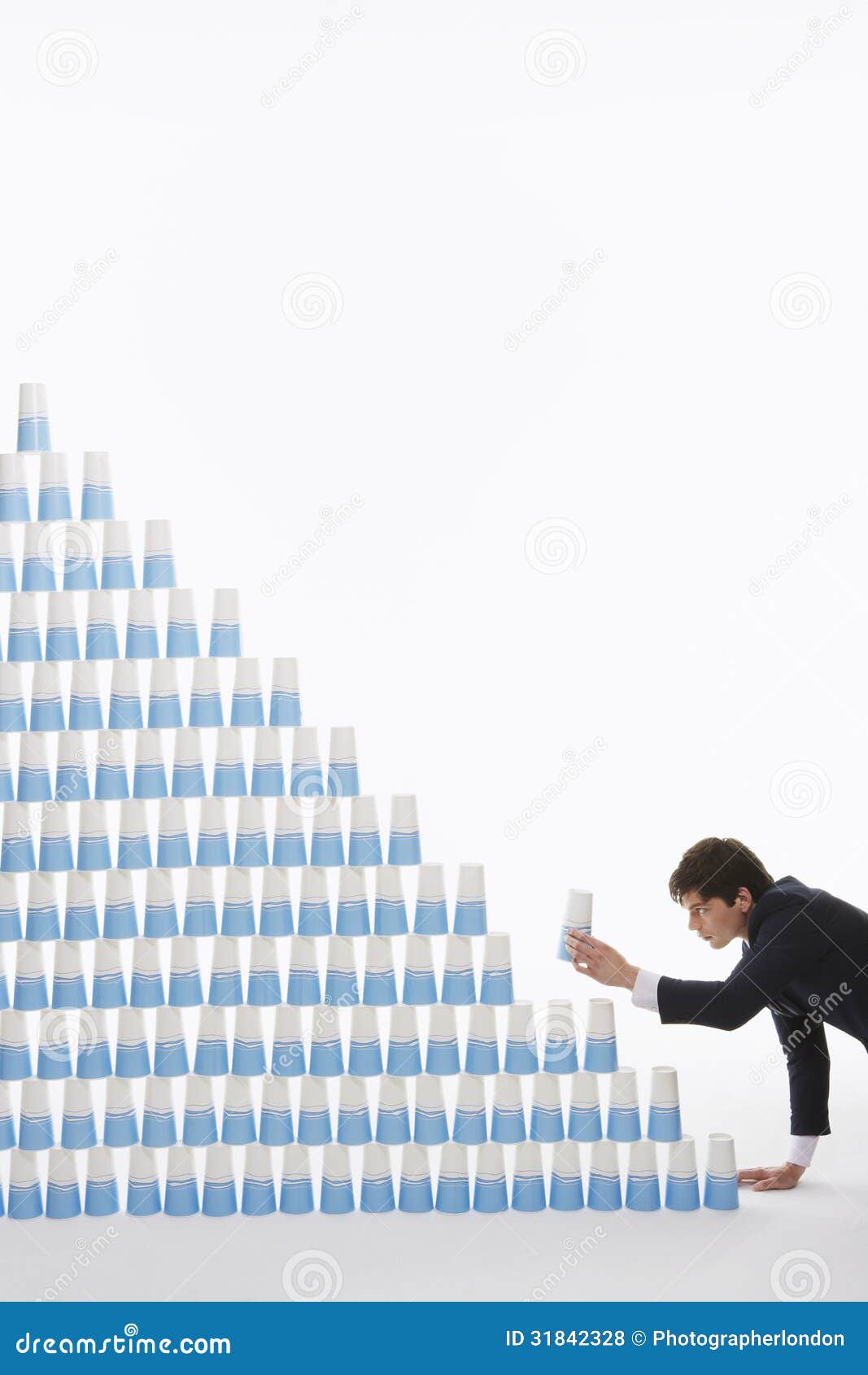 Businessman Stacking Plastic Cups Pyramid Photos - Free & Royalty-Free ...