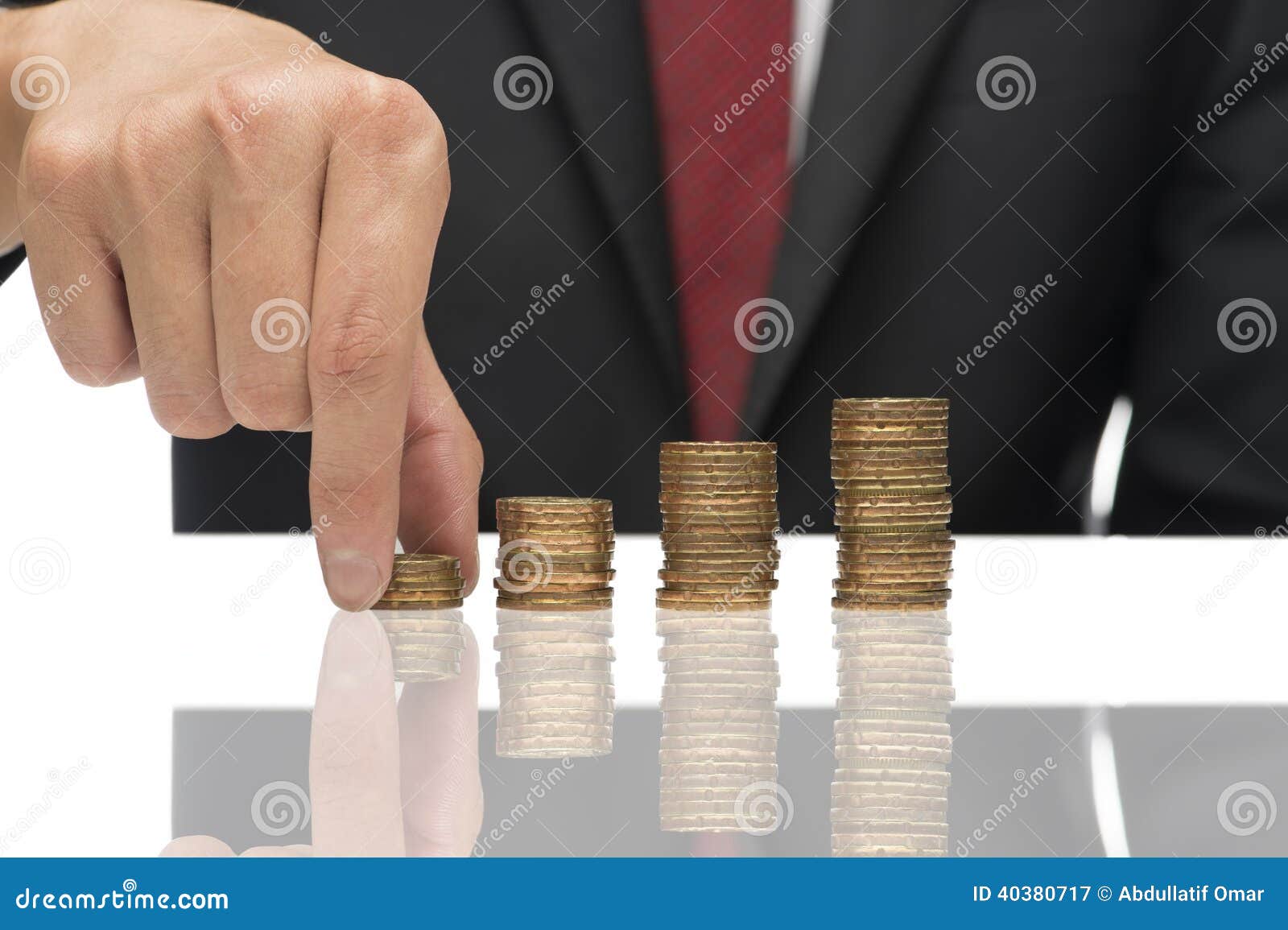 Businessman Stacking Up Coins with Some Reflection Stock Image - Image ...