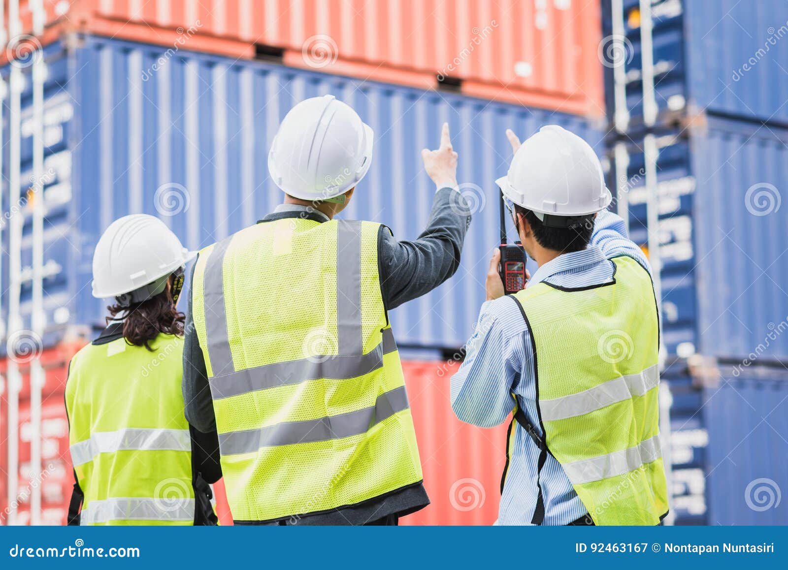 Businessman with Staff in Logistic, Export, Import Industry Checking Shipping Cargo Container ...