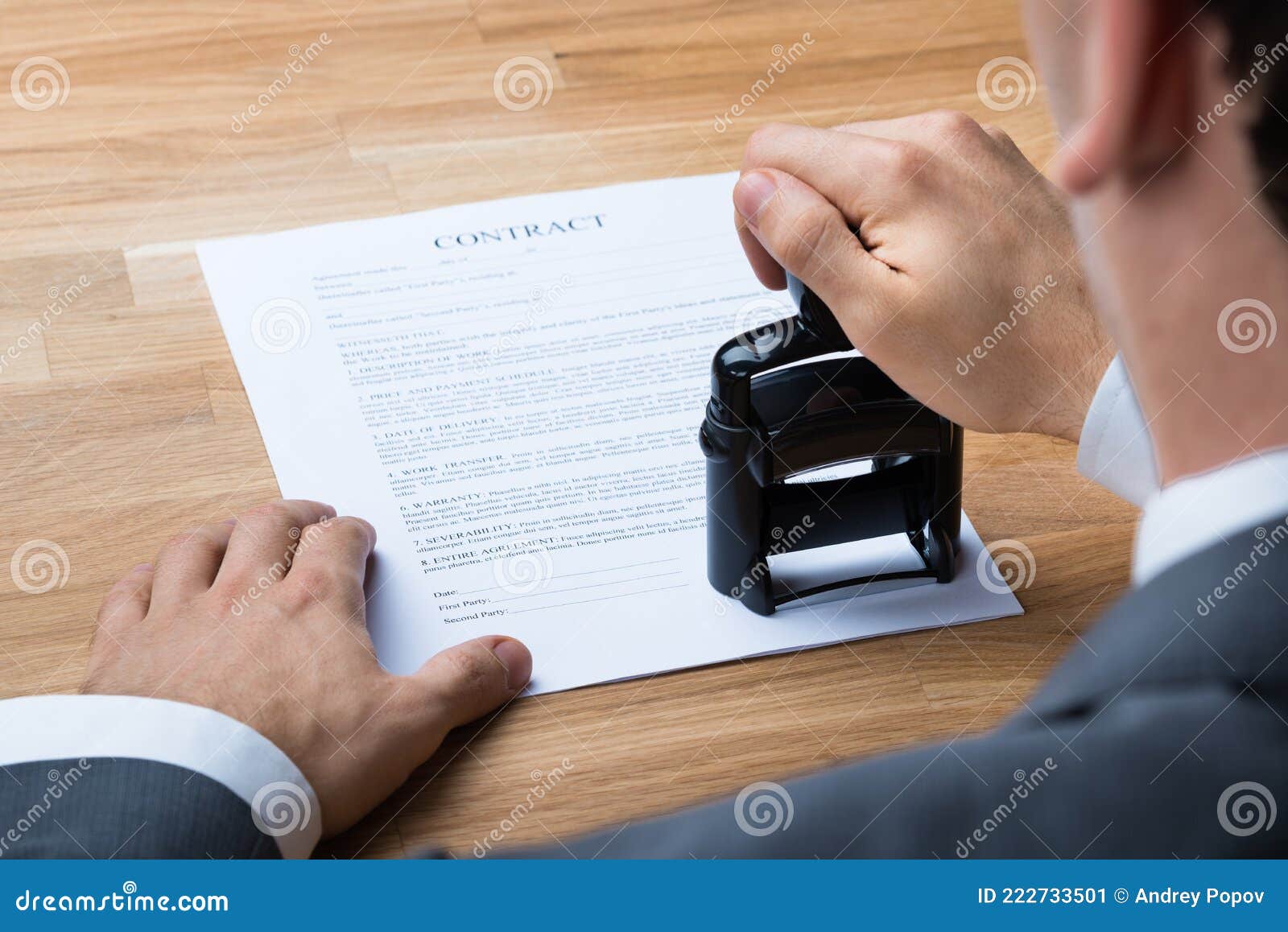 Businessman Stamping Contract Document at Desk Stock Image - Image of ...