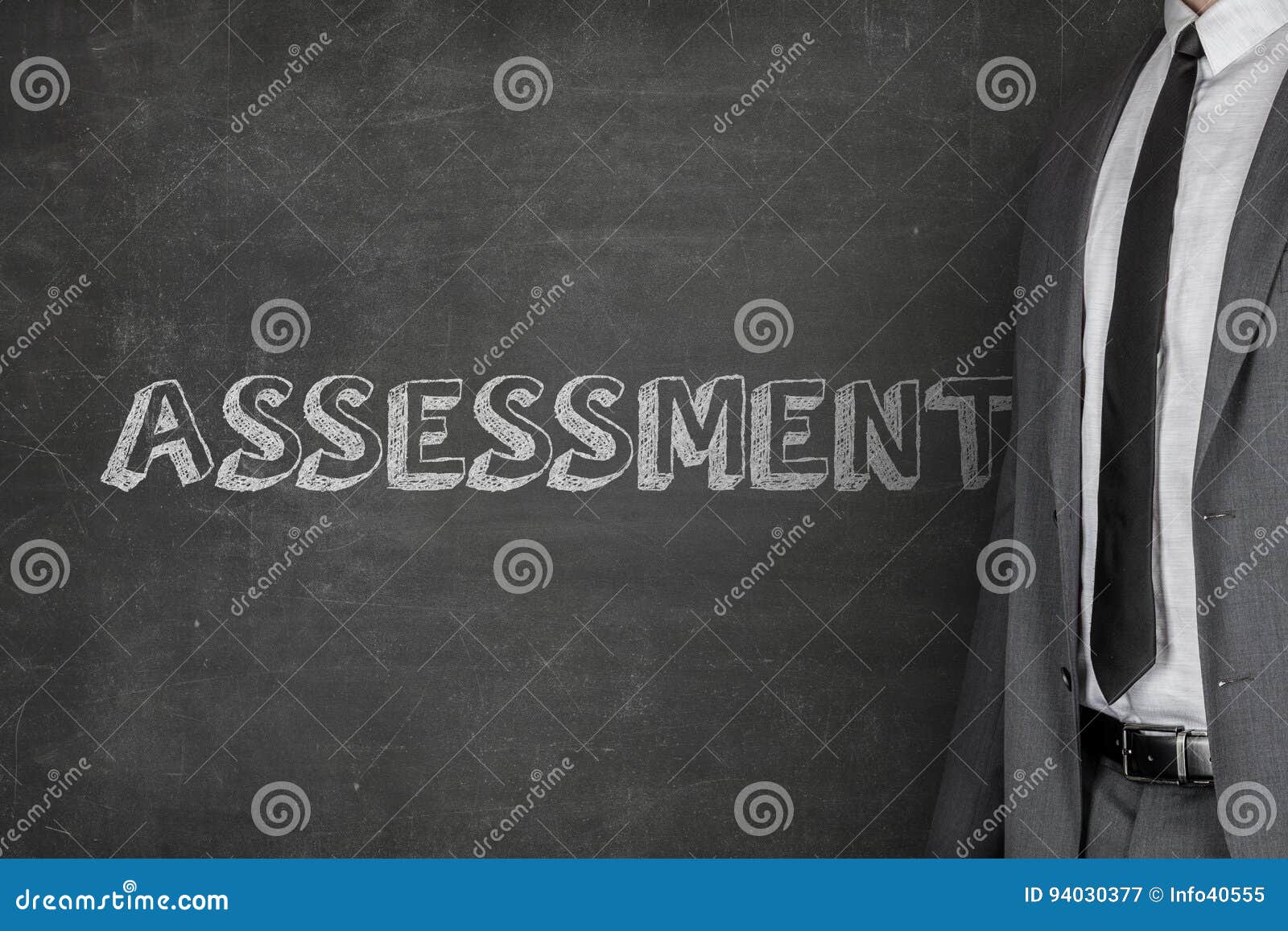 Businessman Standing by Assessment Text on Blackboard Stock Image ...