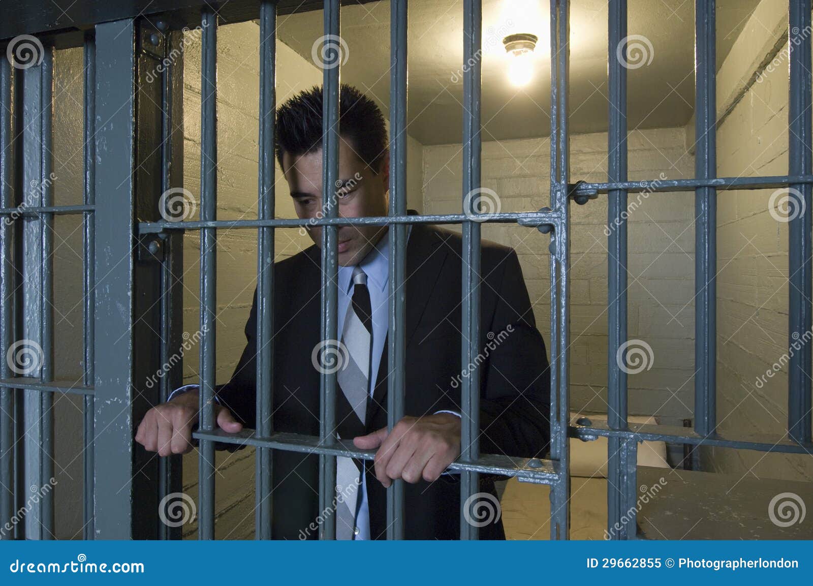 Businessman Standing Behind Bars Stock Image - Image of captive ...