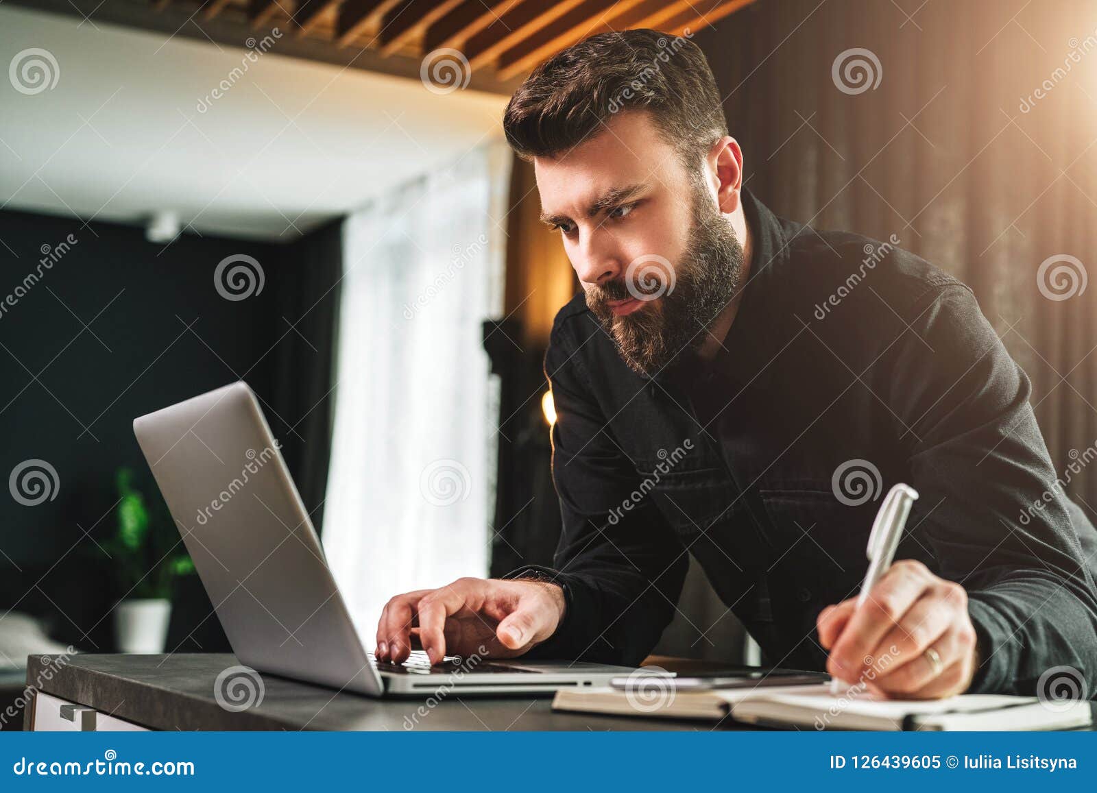 Businessman is Standing by Computer, Looking at Laptop Screen, Making ...