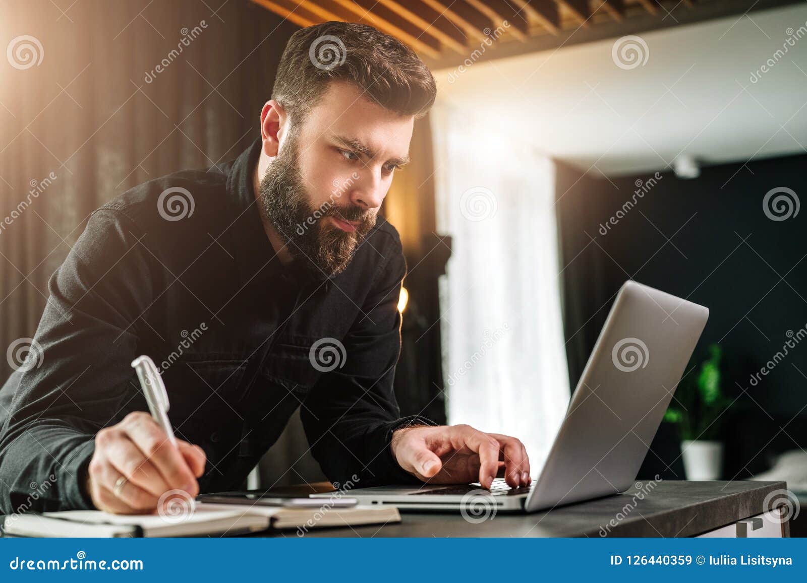 Businessman is Standing by Computer, Looking at Laptop Screen, Making ...