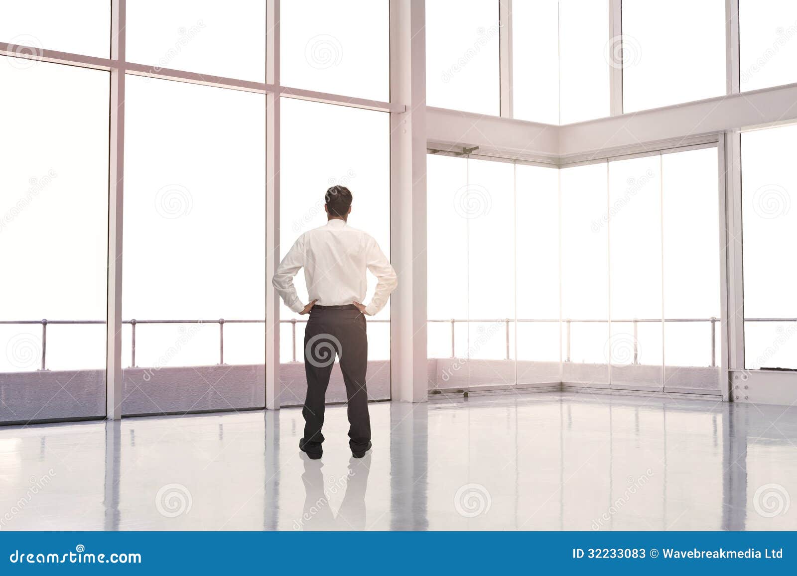 Businessman Standing in an Empty Room Stock Image - Image of hips ...