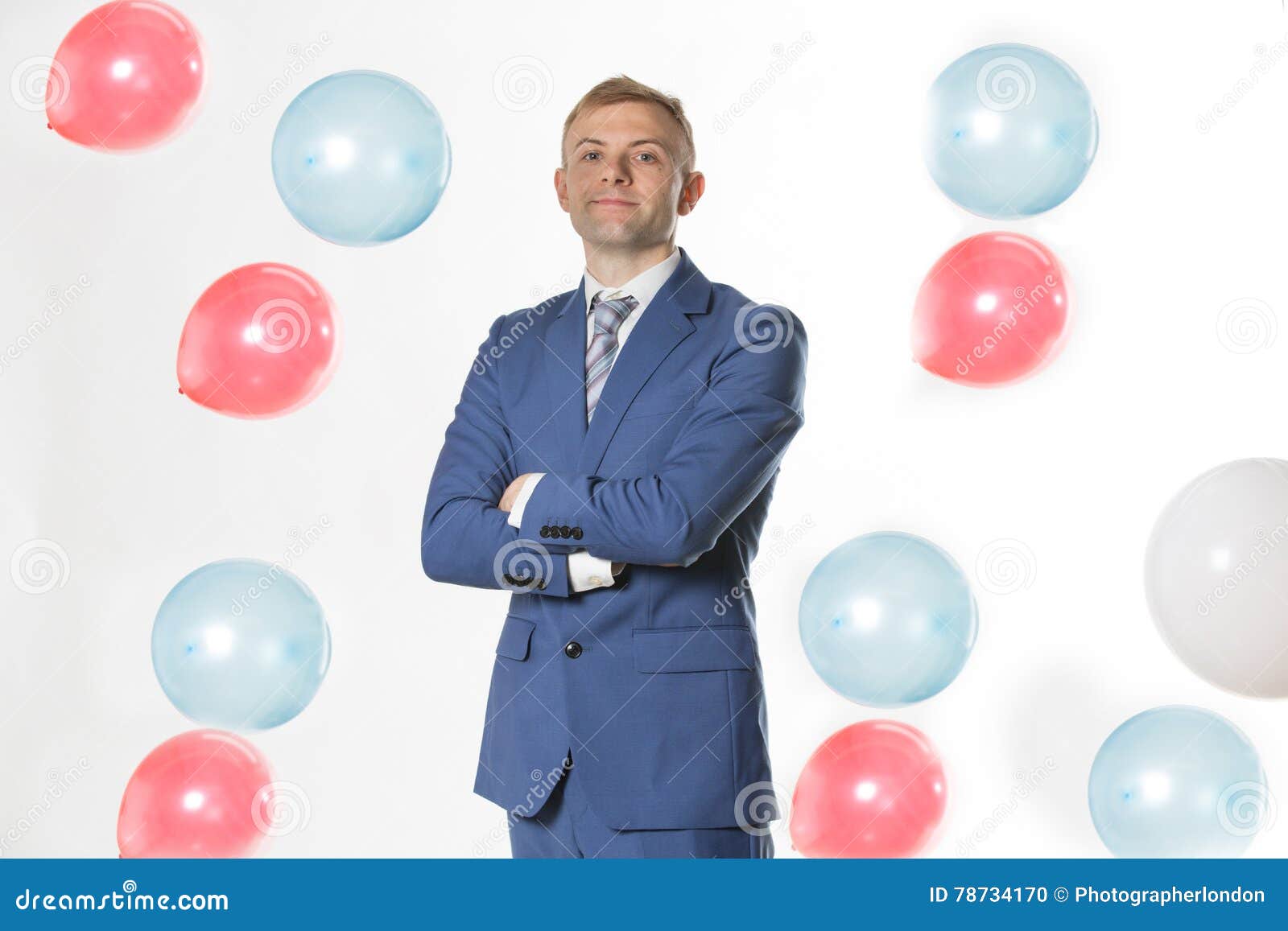 Businessman Standing by Falling Balloons Stock Photo - Image of ...
