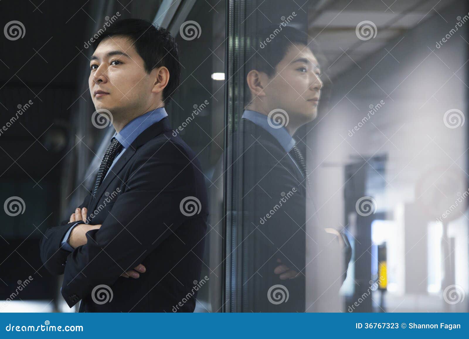 Businessman Standing by Glass Wall, Reflection Stock Image - Image of ...
