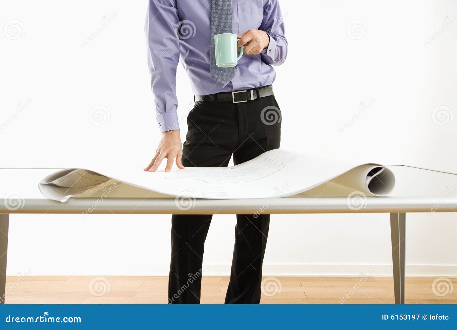 Businessman Standing Over Plans. Stock Image - Image of person, desk ...