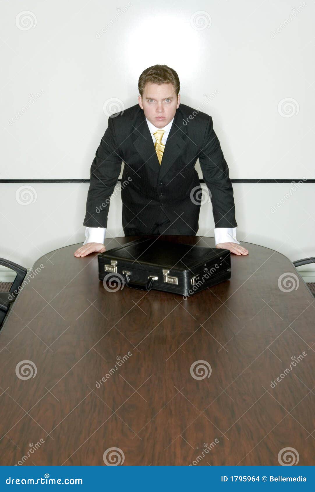 Businessman Stands at the Table Stock Photo - Image of looking ...