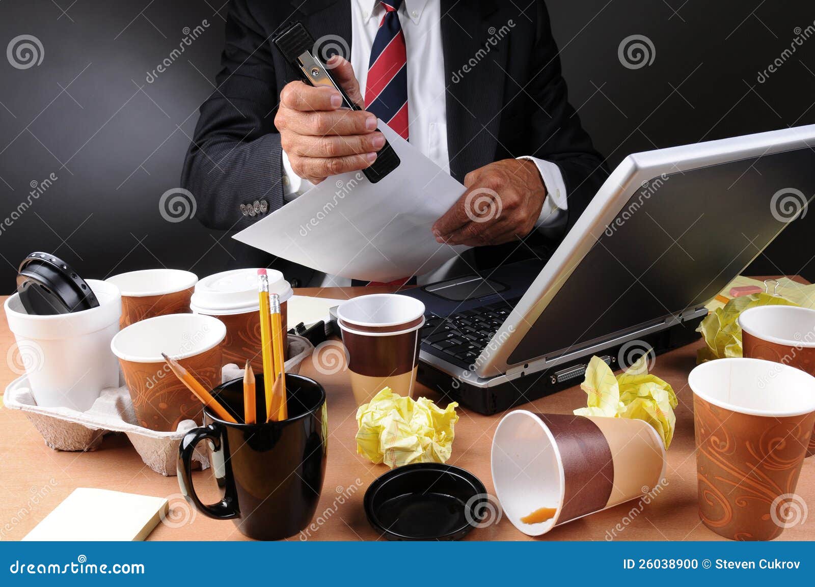 Businessman Stapling Papers at Messy Desk Stock Photo - Image of messy ...