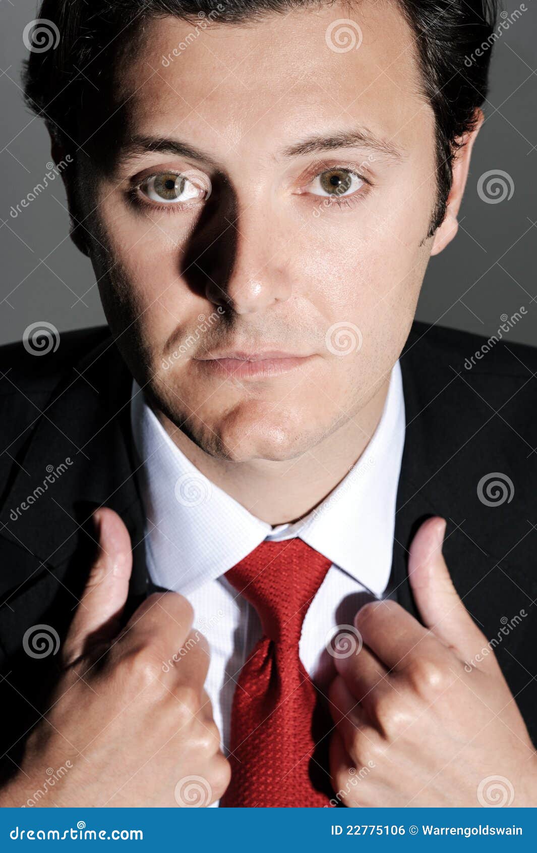 Businessman with a Straight Face Adjusts His Suit Stock Photo - Image ...