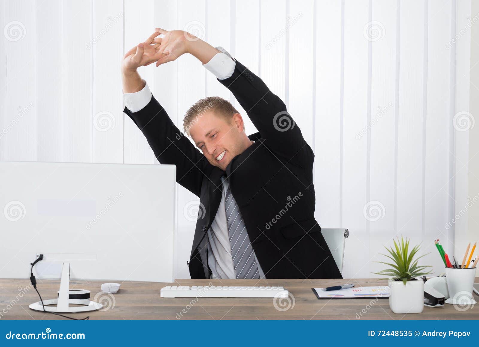 Businessman Stretching in Office Stock Image - Image of profession ...