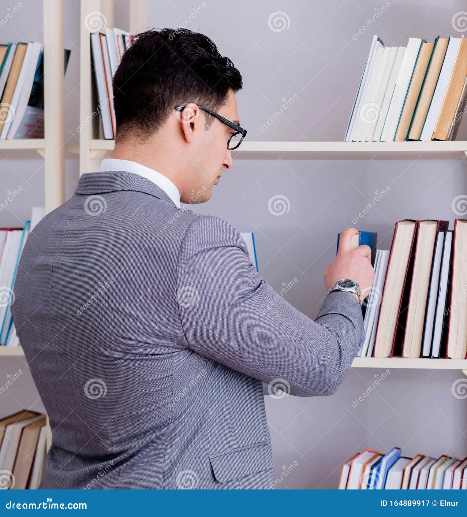 Businessman Student Reading a Book Studying in Library Stock Image ...
