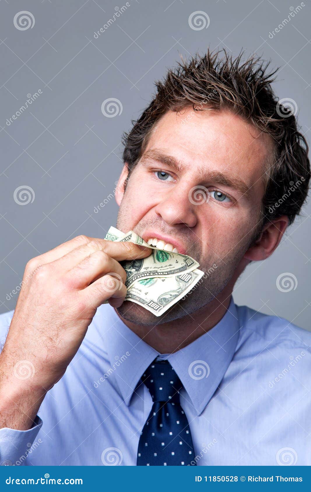 Businessman Stuffing Money in His Mouth. Stock Photo - Image of payment ...