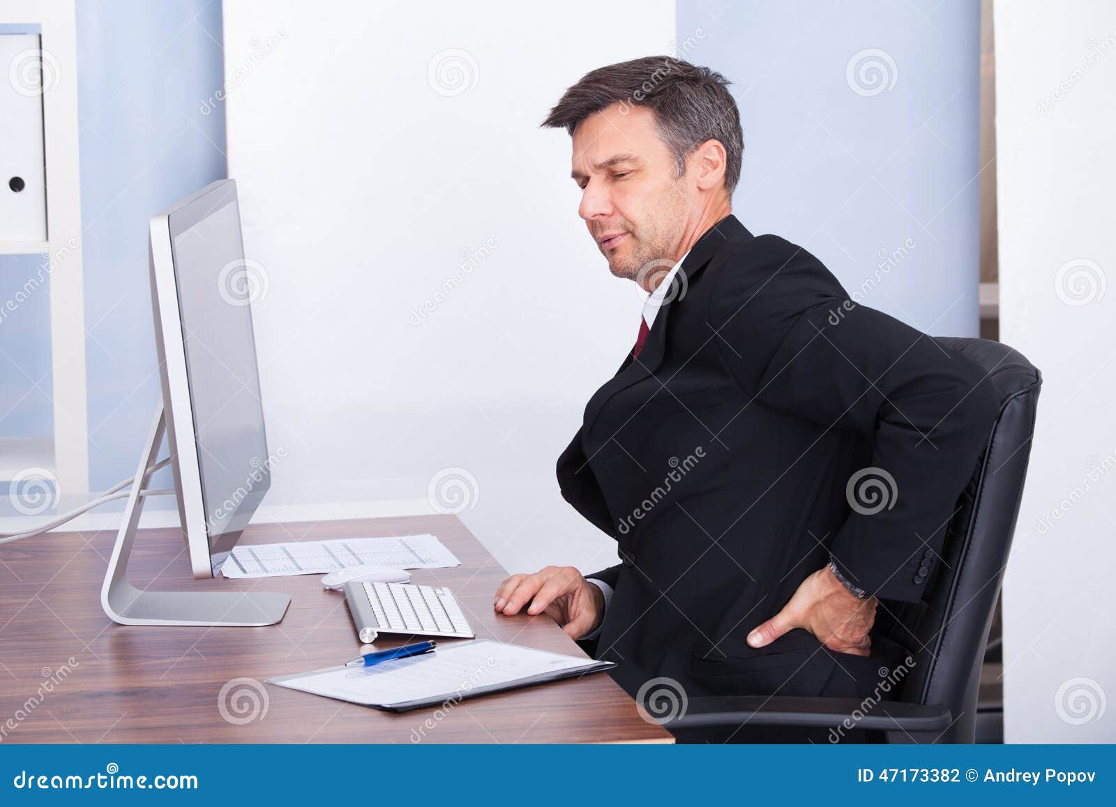 Businessman Suffering from Back Pain Stock Photo - Image of computer ...