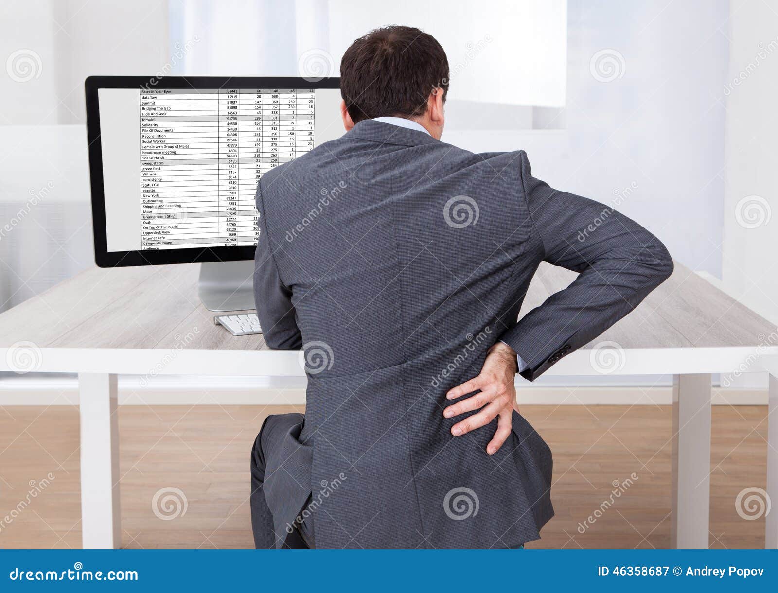 Businessman Suffering from Backache while Sitting at Desk Stock Image ...