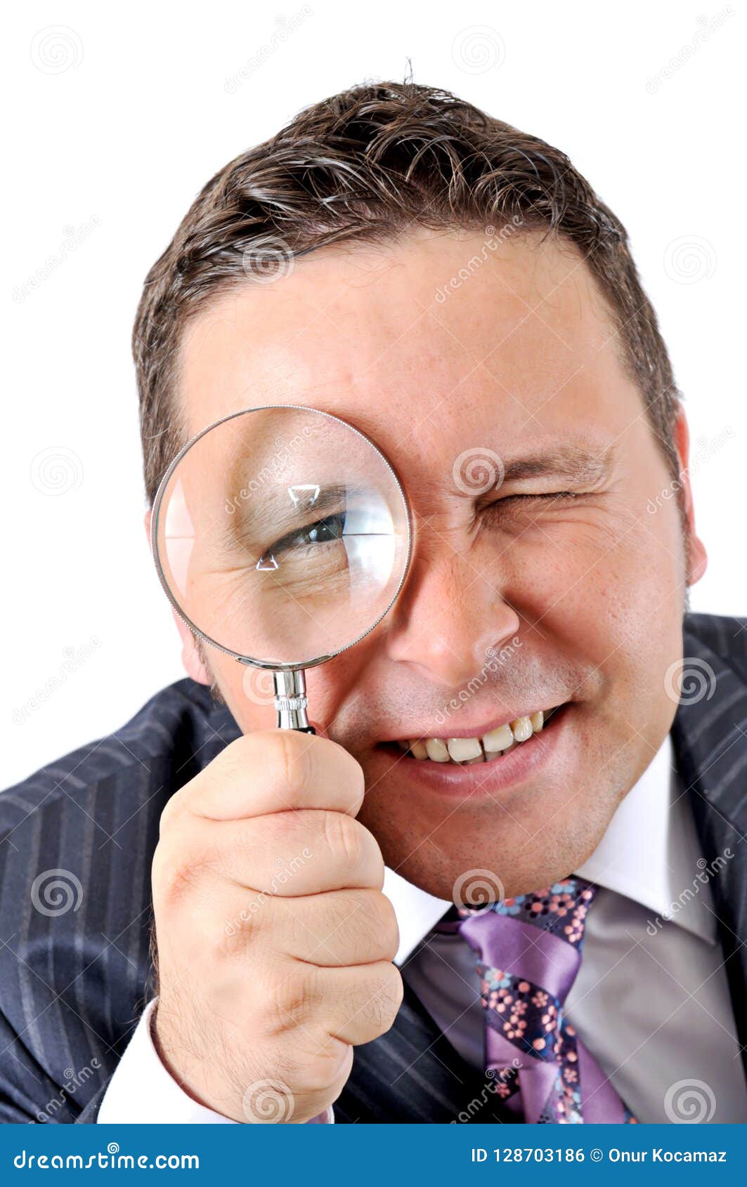 Businessman in a Suit Looking through a Magnifying Glass Stock Photo ...