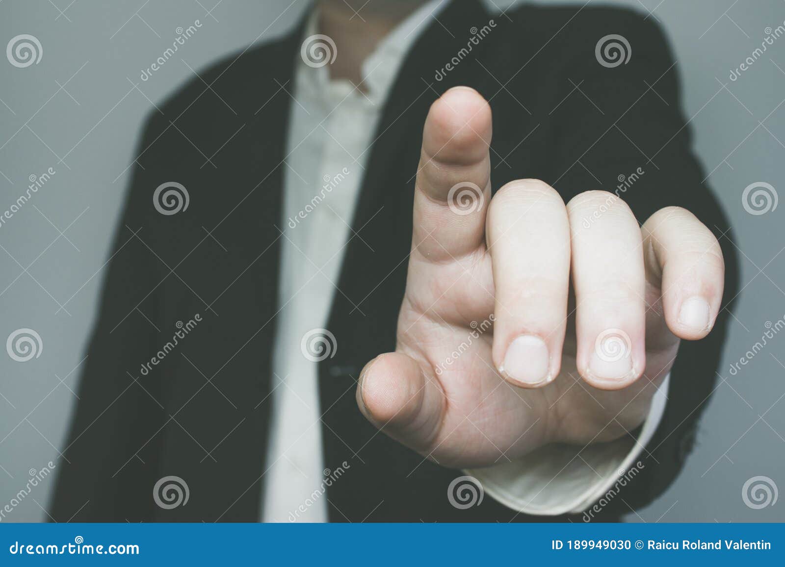 Man in Suit with One Finger Up Stock Photo - Image of gesturing ...
