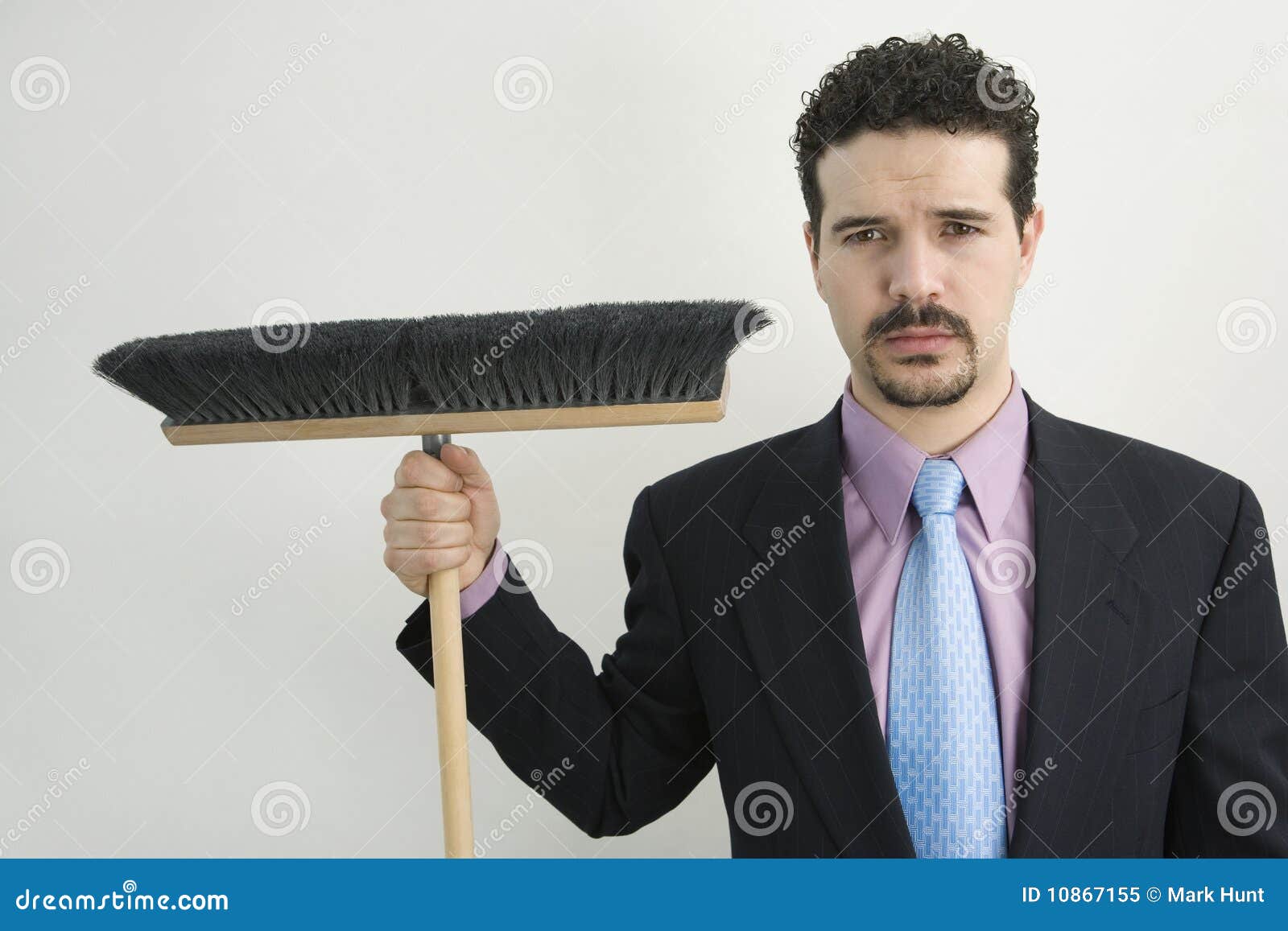 Businessman sweeping stock image. Image of holding, suspicion - 10867155