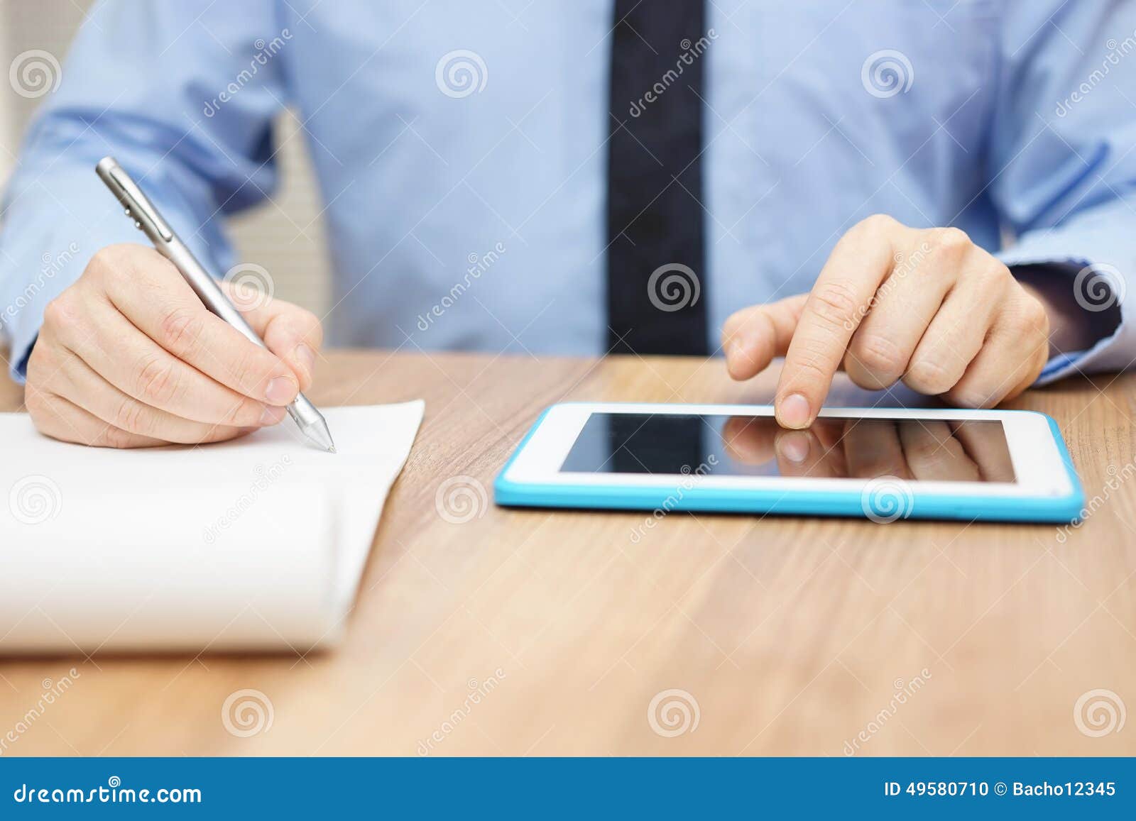 Businessman Taking Business Notes and Working on Tablet Computer Stock ...