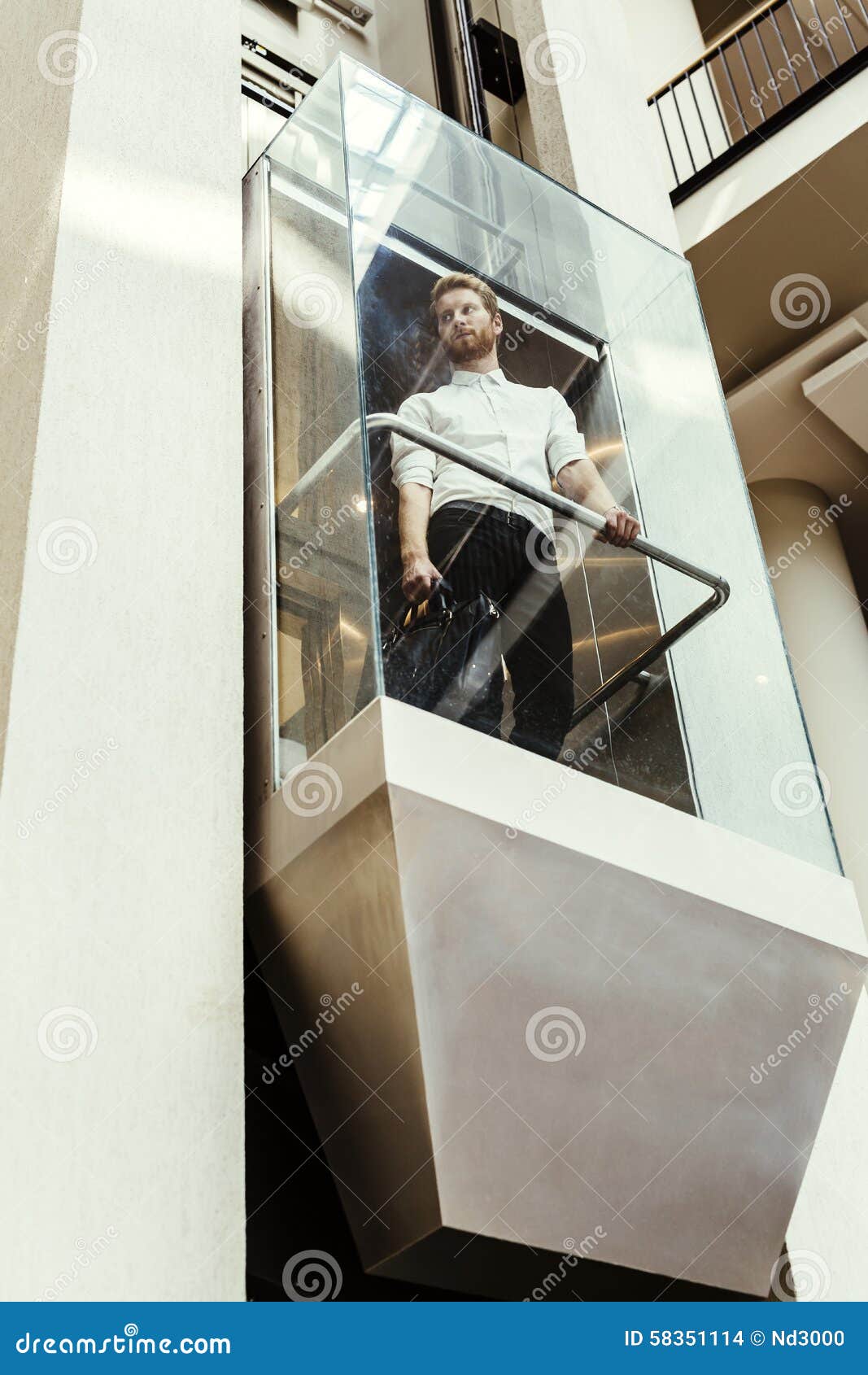 Businessman Taking the Elevator Stock Photo - Image of lift, elevator ...