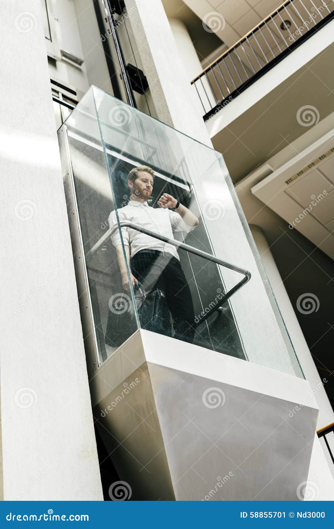 Businessman Taking the Elevator Stock Image - Image of standing ...