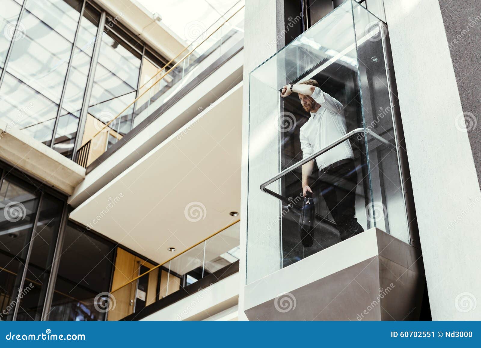 Businessman Taking the Elevator Stock Image - Image of inside, person ...