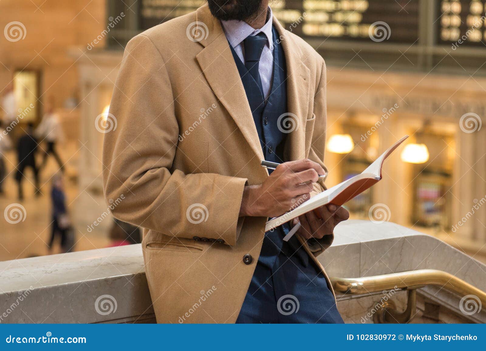 Businessman Taking Note Using Pen and Notepad Wearing Cashmere Jacket ...