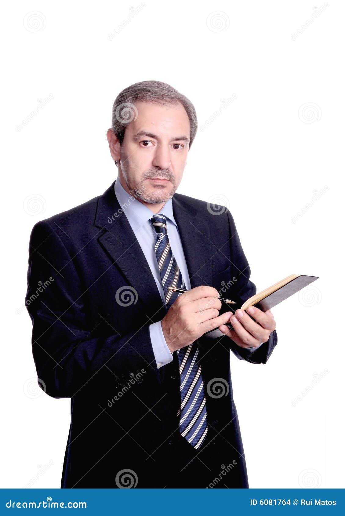 Businessman taking notes stock photo. Image of standing - 6081764