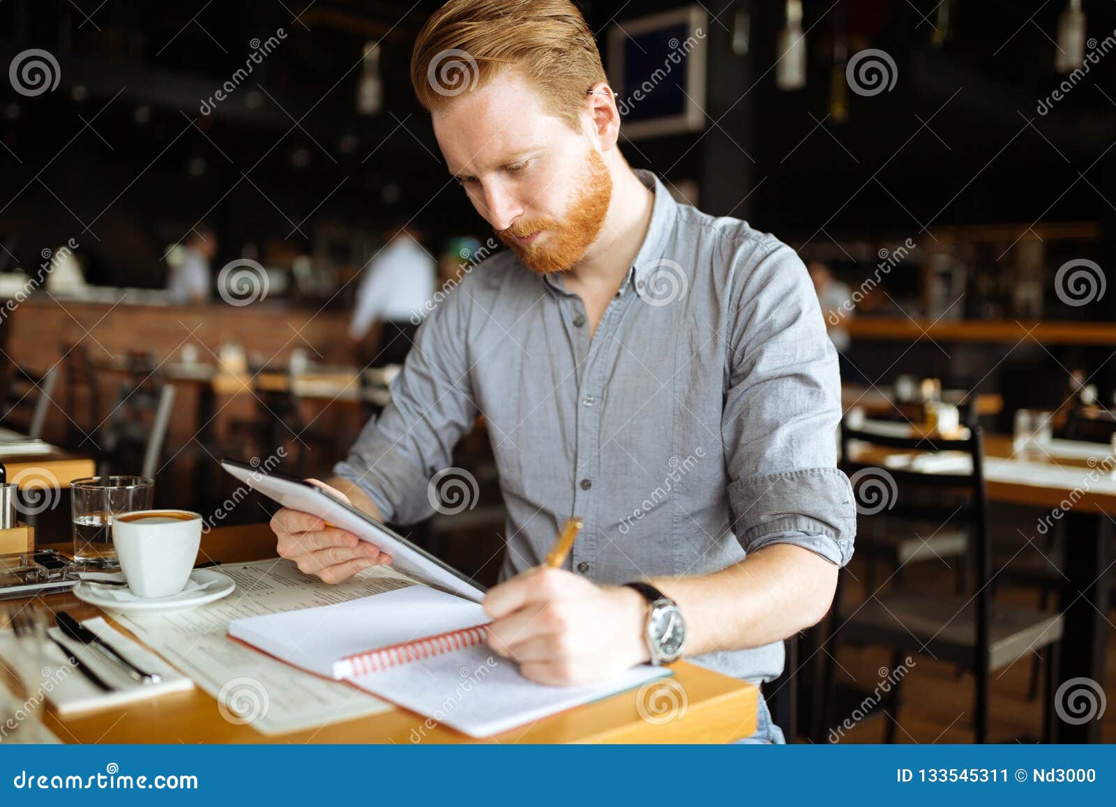 Businessman taking notes stock image. Image of corporate - 133545311