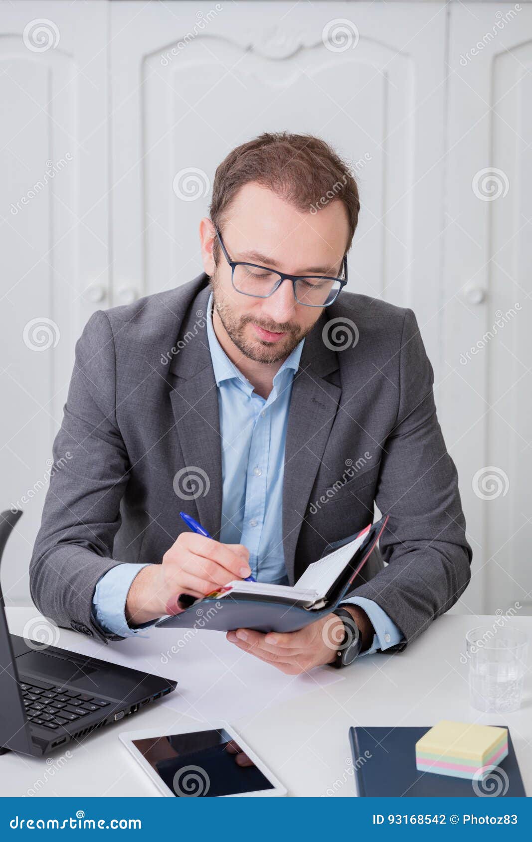 Businessman Taking Notes at His Desk Stock Photo - Image of desk ...