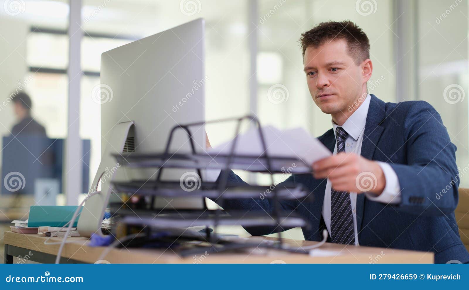 Businessman Taking Out Paper from Tray on Desk in Office Stock Image ...