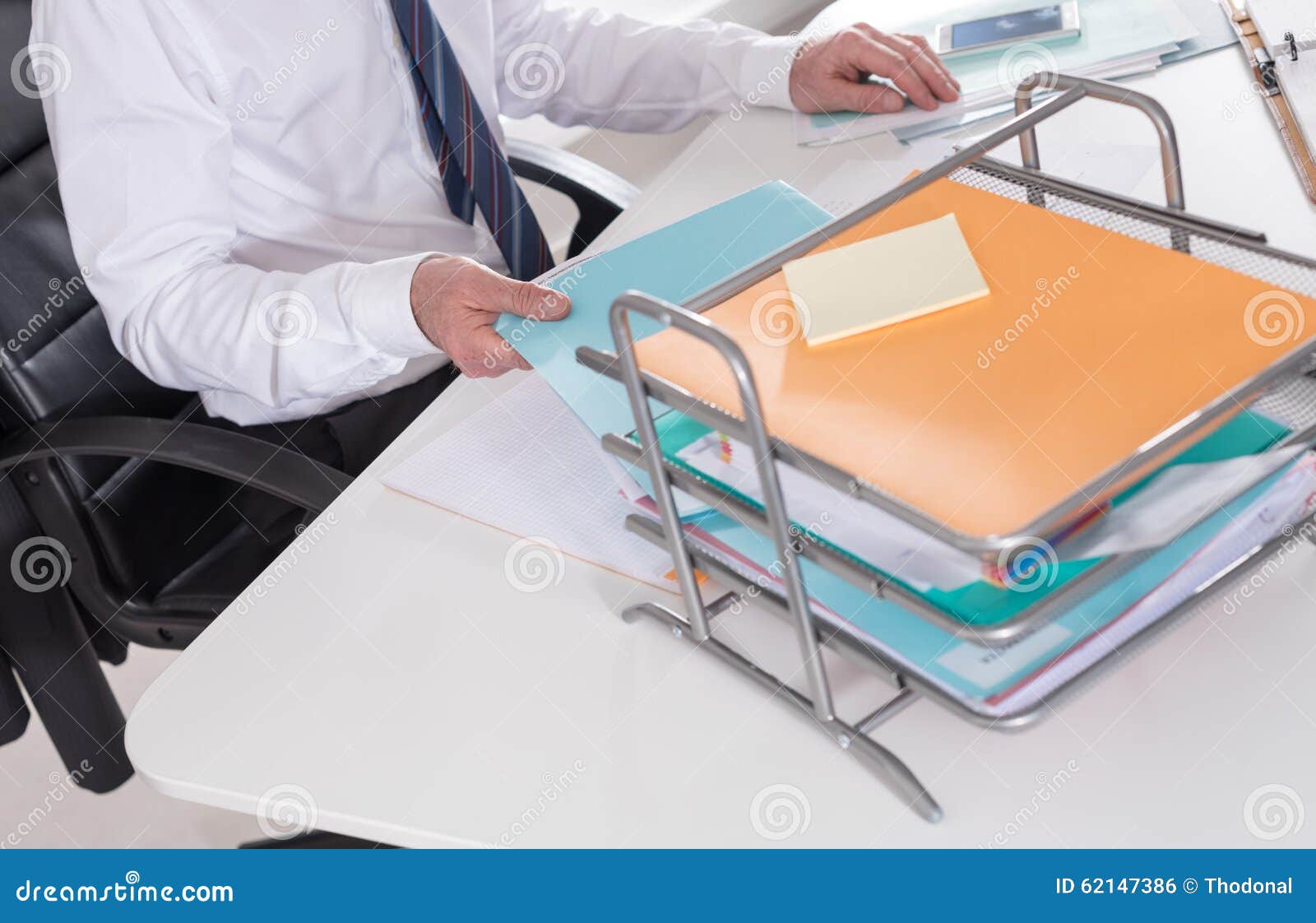Businessman Taking a Record of His Paper Tray Stock Photo - Image of ...