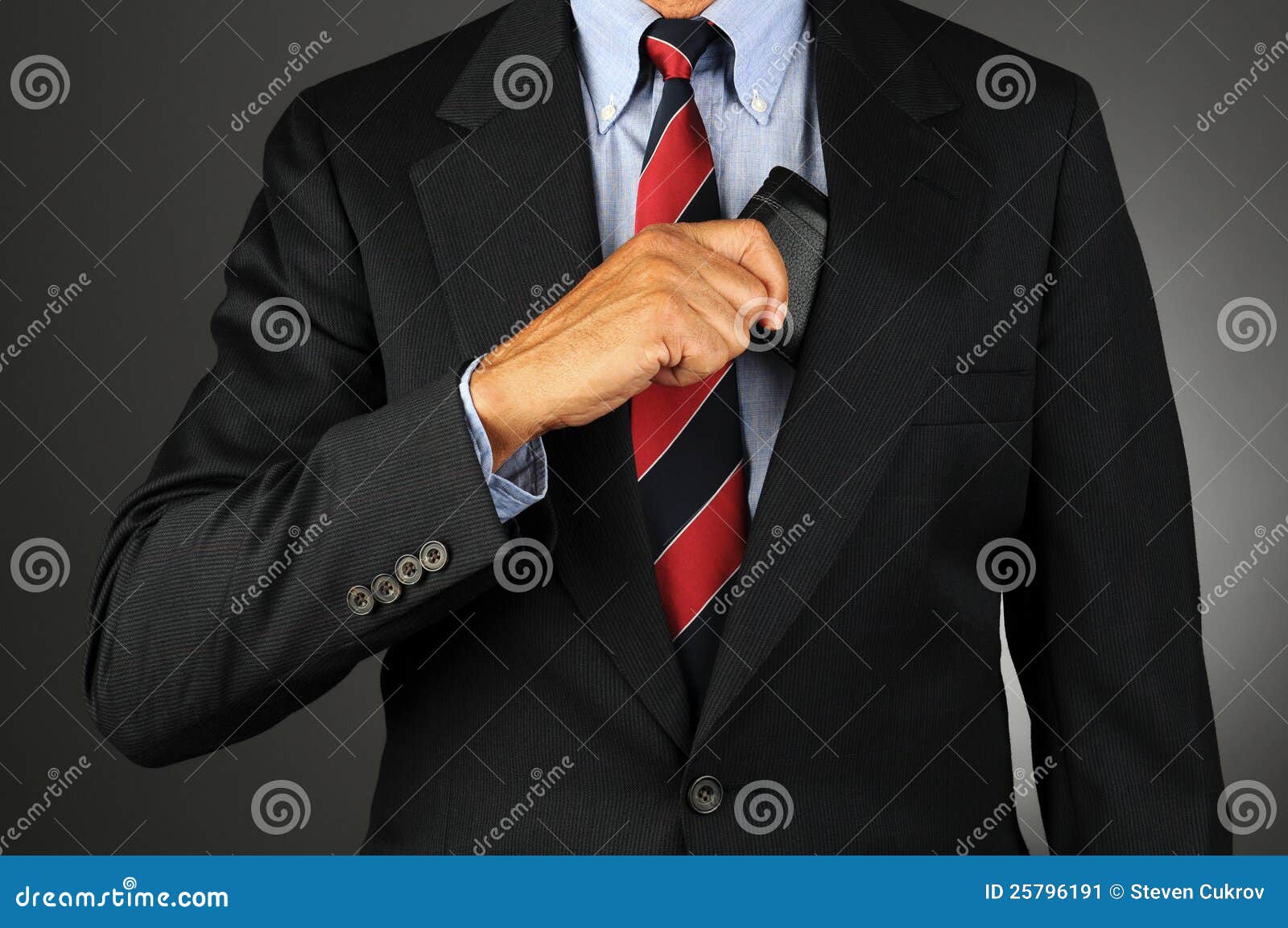 Businessman Taking Wallet from Inside Coat Pocket Stock Image - Image ...