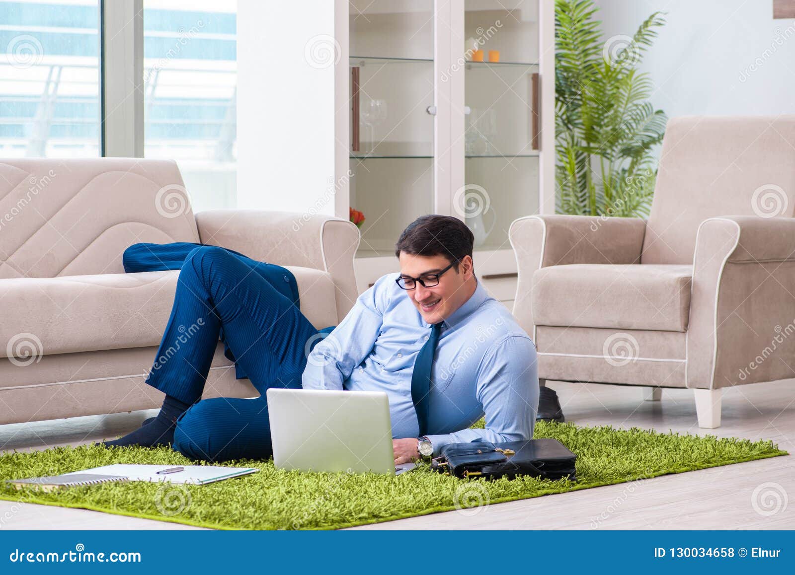 The Businessman Taking Work Home and Working Overtime Stock Photo ...